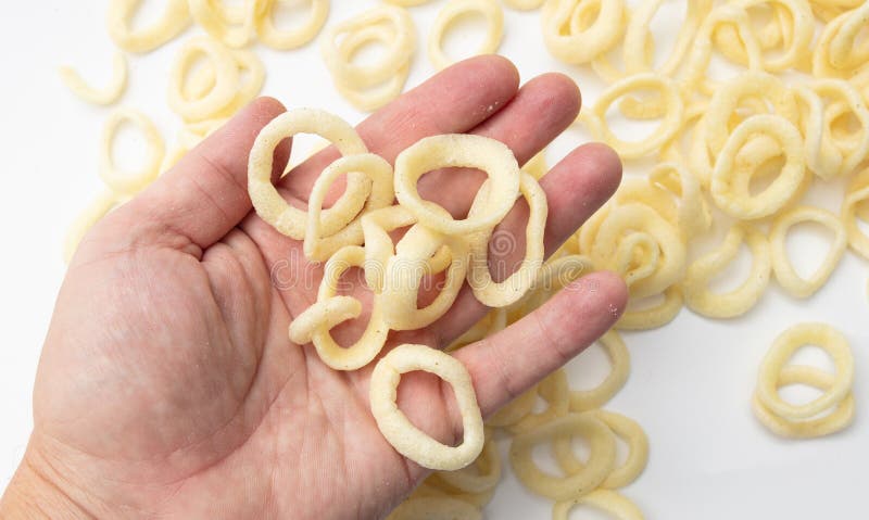 Onion ring chips in hand. stock photo. Image of food - 271494188