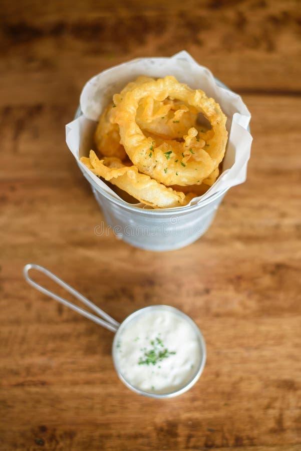 Onion rings and dip sauce stock image. Image of dinner - 253382129