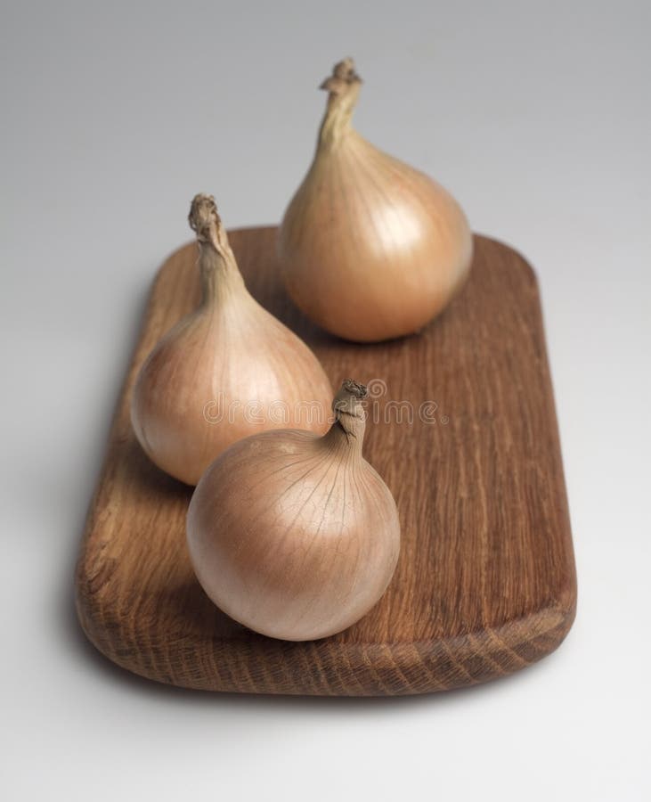 Onions on a kitchen board. stock image. Image of onions - 23154609