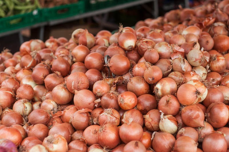 Onions stack at the market stock image. Image of flavor - 137654081