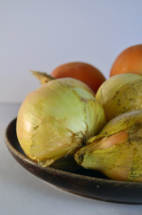 Onions on the table stock photo. Image of following - 120743446
