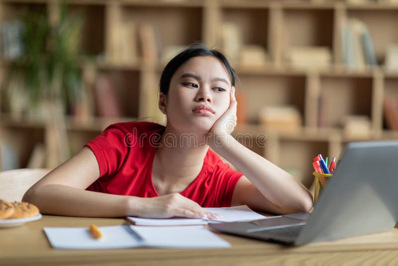Online Education at Home. Boring Tired Asian Woman Watching Video ...
