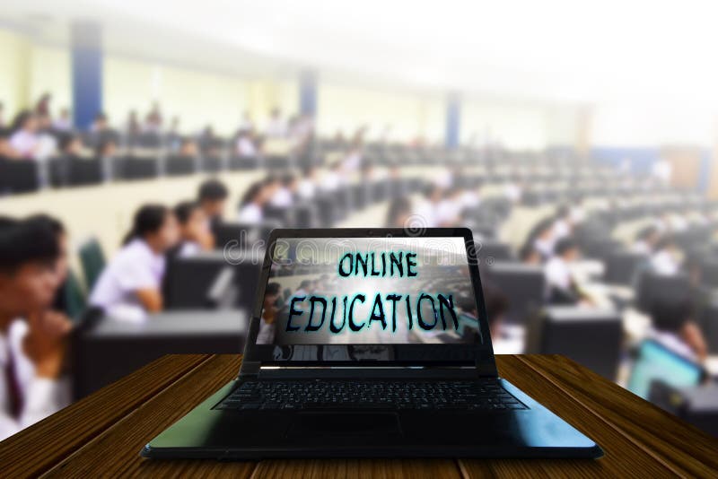 Online Education System, Black Laptop on a Wooden Table, Classroom Blur ...