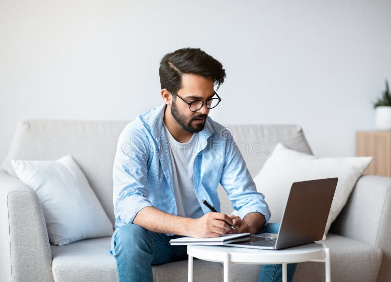 Online Education. Young Eastern Man Study with Laptop at Home, Taking ...