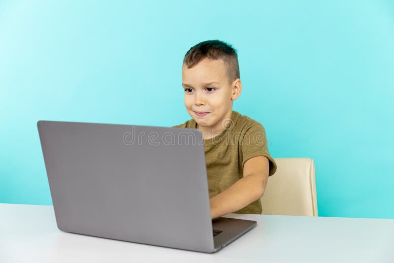 Online Home Learning Concept. Boy Sitting with Computer and Doing ...