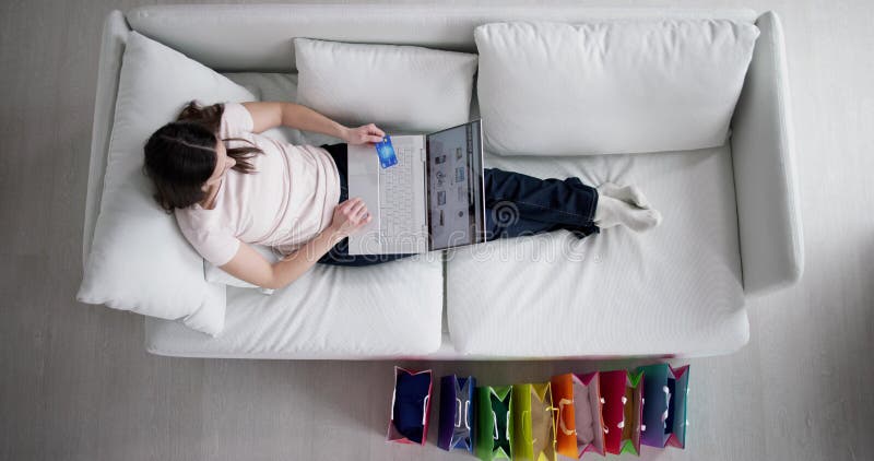 Online Laptop Shopper on Sofa Stock Image - Image of shopping, house ...