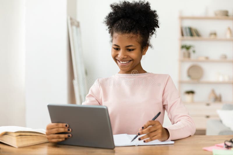 Secondary School Student Girl Studying Using Digital Tablet at Home ...