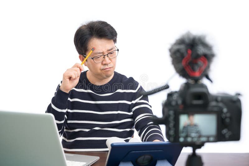 Online Learning Concept. an Asian Middle-aged Male Teacher Preparing To ...