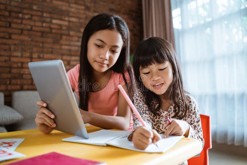 Online Learning with Older Sister at Home Stock Image - Image of people ...