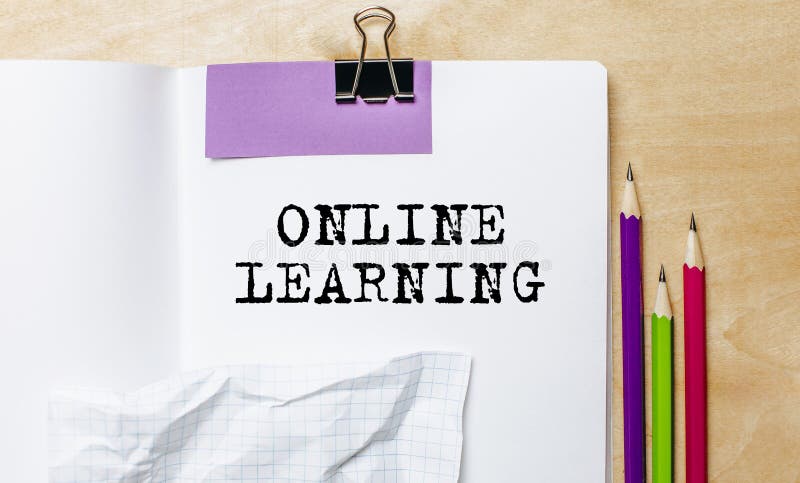 ONLINE LEARNING Text Written on a Paper with Pencils on the Desk in the ...