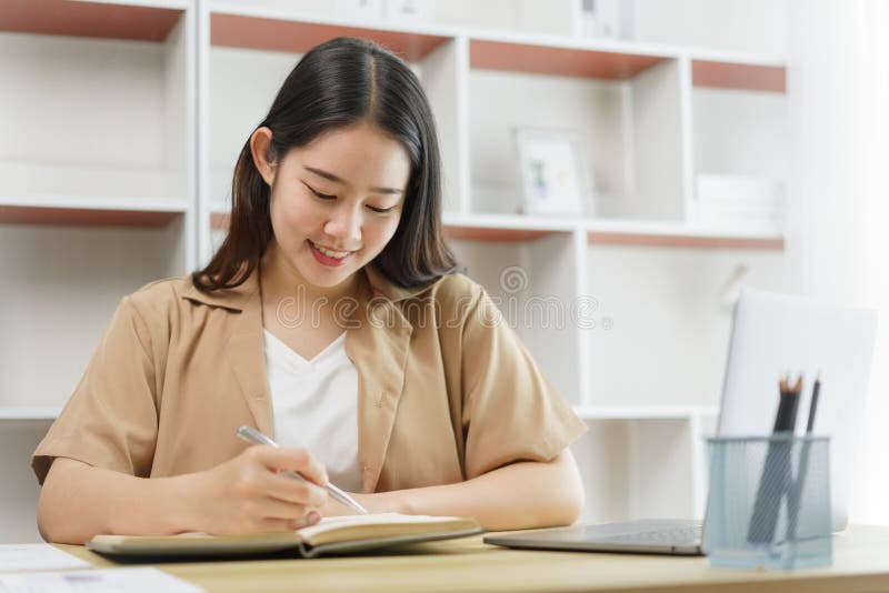 Online Lifestyle Concept the Female Home Worker Writing Down the ...