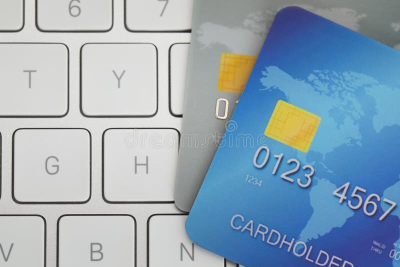 Online Payment Concept. Bank Cards on Computer Keyboard, Top View Stock ...