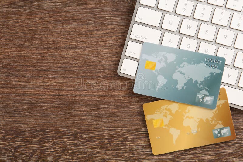 Online Payment. Credit Cards and Keyboard on Wooden Table, Flat Lay ... Online Payment. Credit Cards and Keyboard on Wooden Table, Flat Lay ...