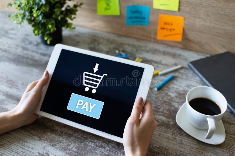Online Payment an E-commerce Concept. Pay Button on Tablet Screen ...