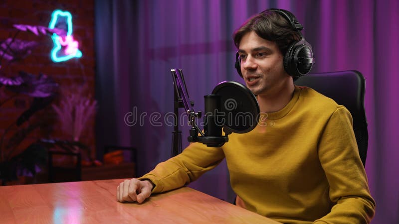 Man Host Wearing Headphones, Sitting at Table and Recording Interview ...
