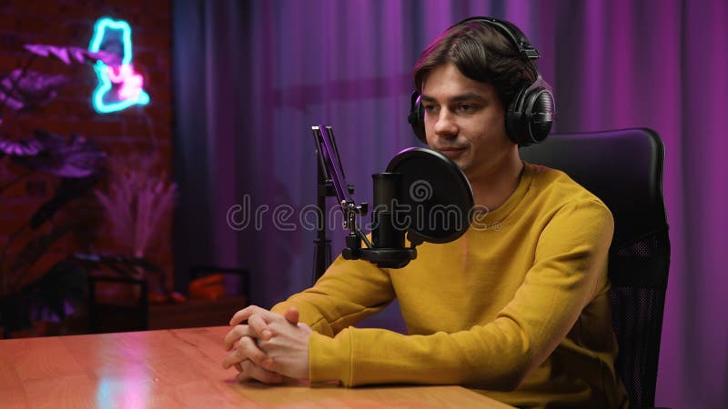Man Host Wearing Headphones, Sitting at Table and Recording Interview ...