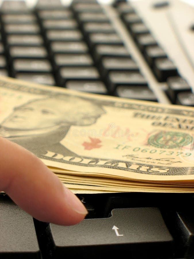 Money on a Keyboard stock image. Image of internet, hold - 492619