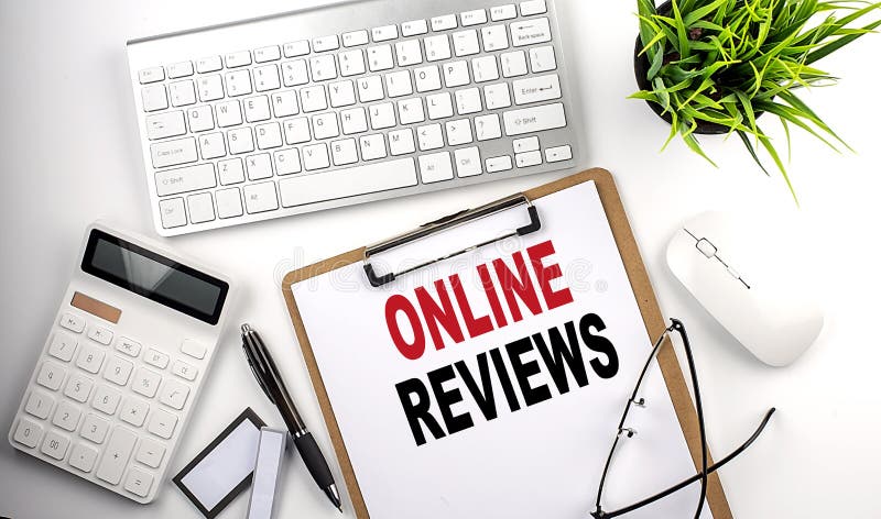 ONLINE REVIEWS Text on White Paper. the Inscription on the Notebook ...