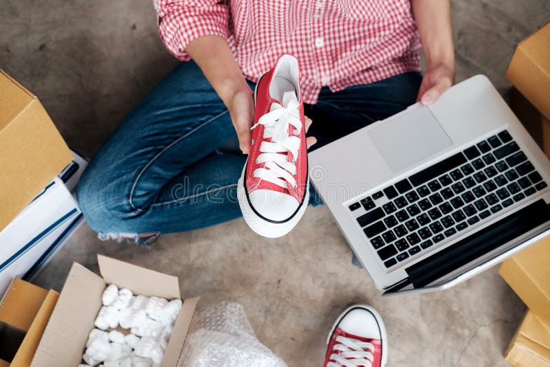 Online Seller Owner Using Computer for Checking Customer Orders. Stock ...