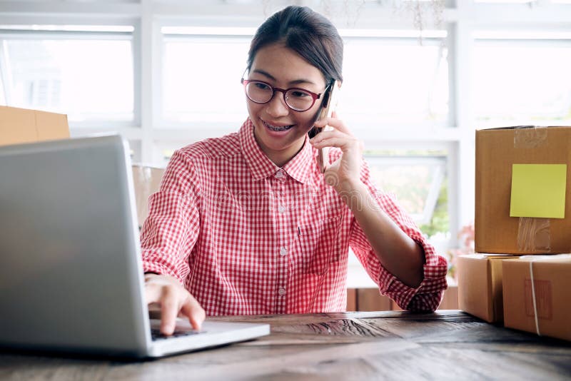 Online Seller Owner Using Computer for Checking Customer Orders. Stock ...