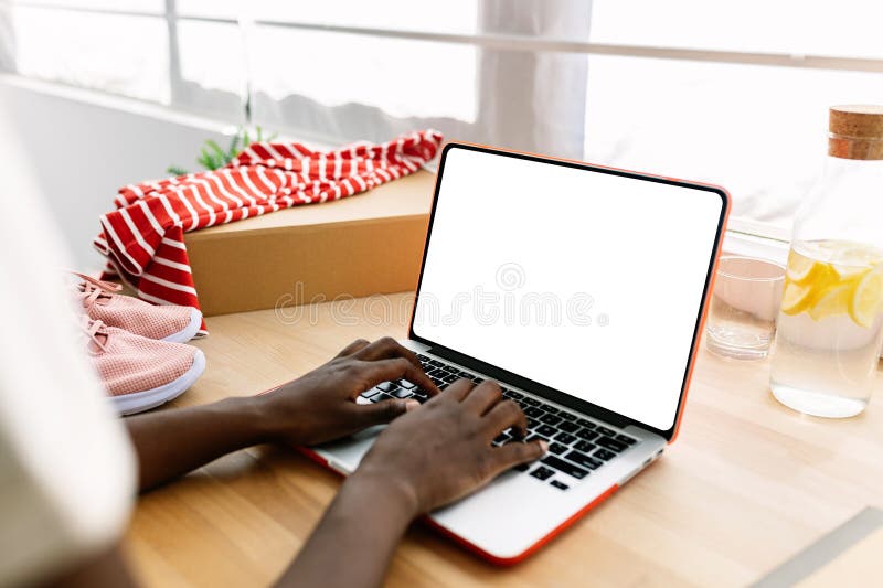 Online Seller Typing on Laptop with Blank Screen, Preparing a Package ...