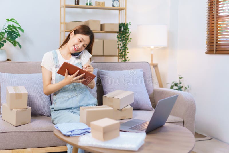 Online Shopping Concept, Female Entrepreneur Taking Notes in Notebook ...