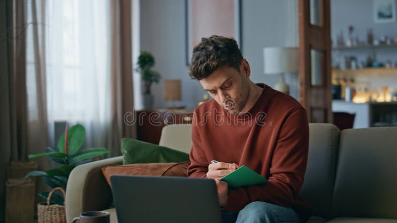 Online Student Studying Home Looking Laptop Screen. Serious Man Making ...