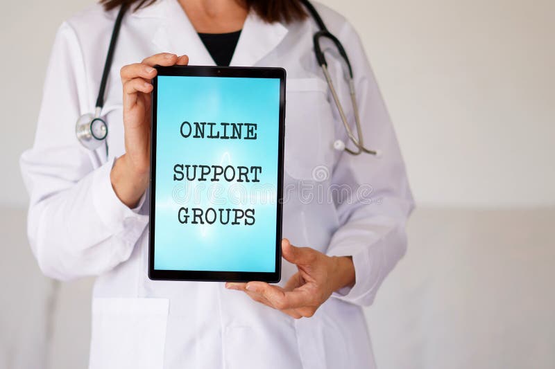 ONLINE SUPPORT GROUPS Concept. Words Written on a Tablet Held in the ...