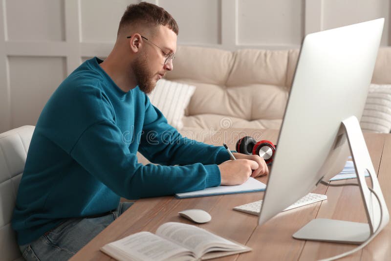 Online Test. Man Studying at Desk Indoors Stock Image - Image of ...