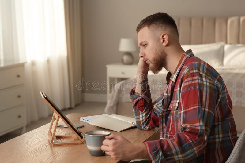 Online Test. Man Studying with Tablet at Home Stock Image - Image of ...