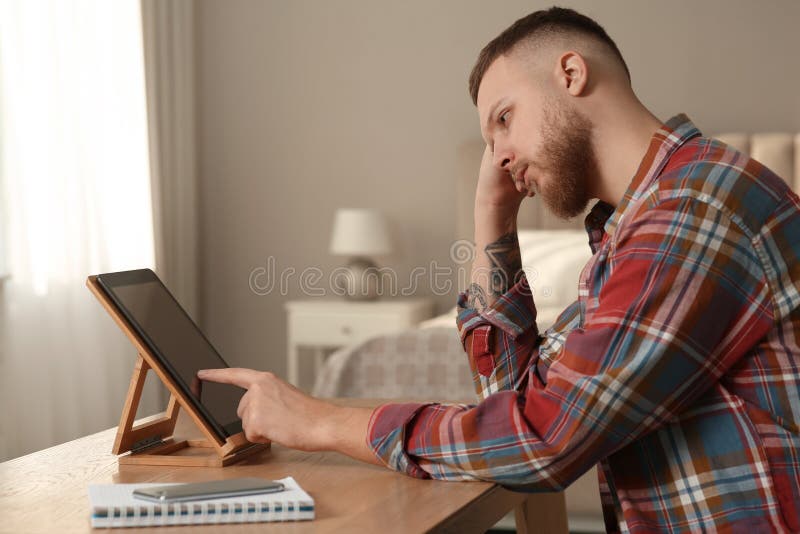 Online Test. Man Studying with Tablet at Home Stock Image - Image of ...