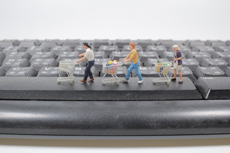 The Online Trade. Computer Keyboard with Mini Figures Stock Photo ...