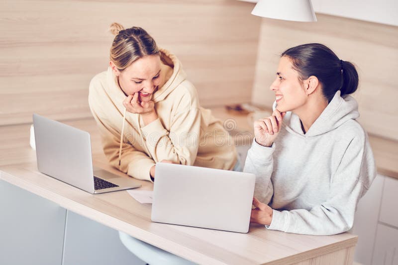 Online Training. Two Happy Women Using a Laptop, Work and Study Online ...