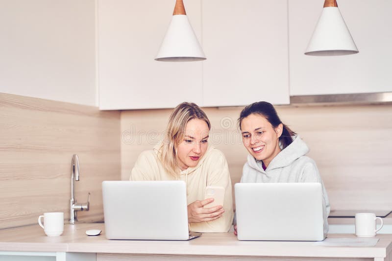 Online Training. Two Happy Women Using a Laptop, Work and Study Online ...