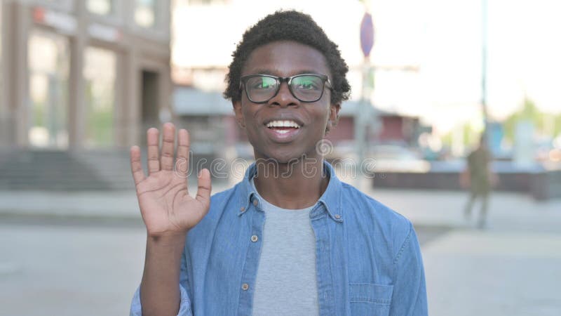 Online Video Chat by Talking Young African Man Outdoor Stock Photo ...