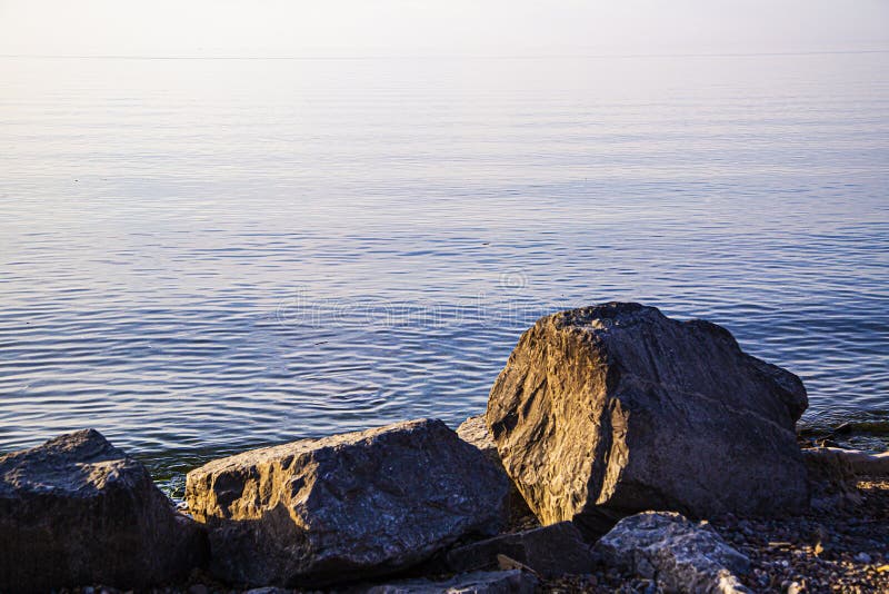 Ontario Lake in the Evening and Rocks Stock Photo - Image of pear ...