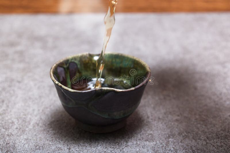 Oolong Tea Being Poured into a Teacup. Stock Photo - Image of tableware ...