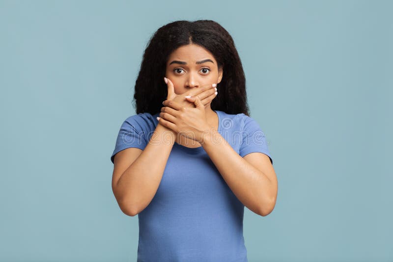 Oops African American Woman Covering Her Mouth With Both Hands And