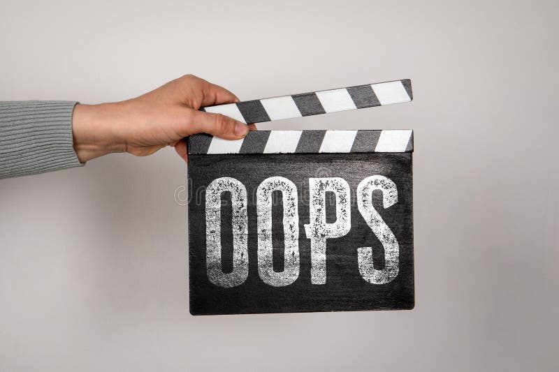 OOPS. Hand Holding Movie Clapper. Stock Image - Image of alarm ...