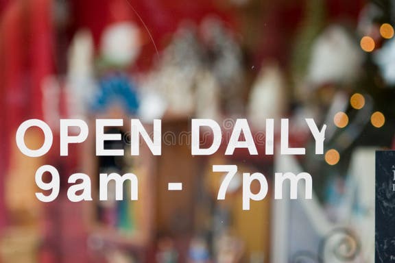 Open daily 9am to 7pm stock image. Image of business, sign - 982861