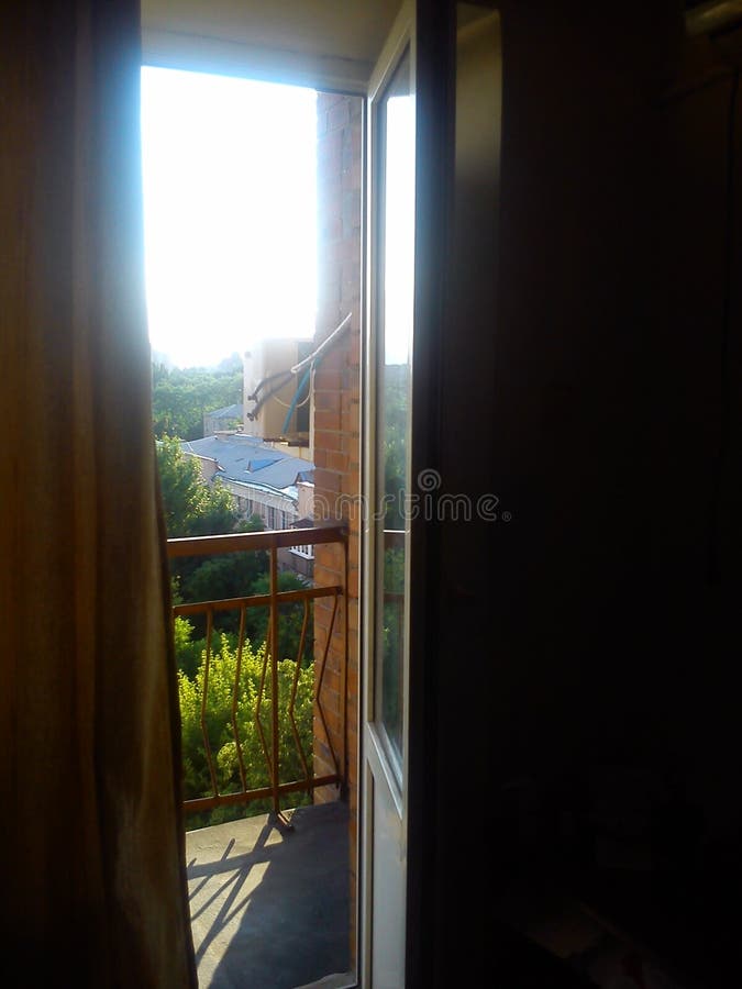 Open Balcony Door with a View of the Street with Trees Stock Image ...