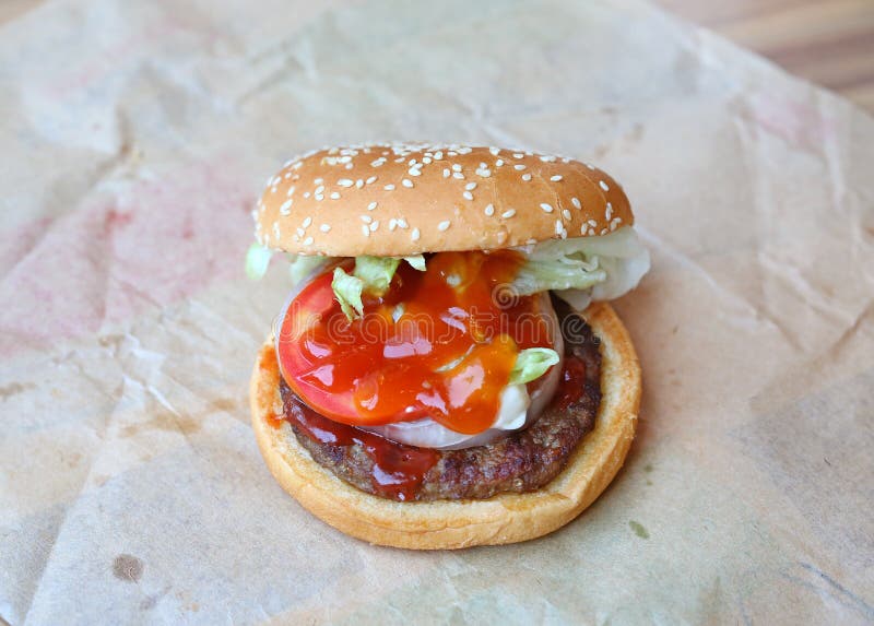 Open Beef burger on paper stock image. Image of fried - 140037317