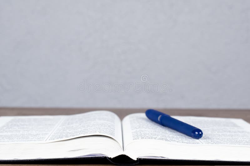 Open Bible. Scripture. Pen on the Table. Education and Training. Stock ...