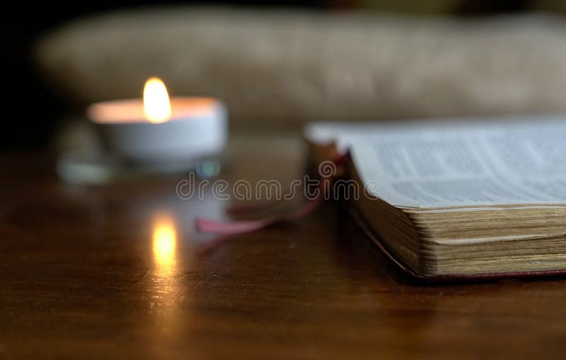Open Bible with Burning Candle on the Table Stock Photo - Image of ...
