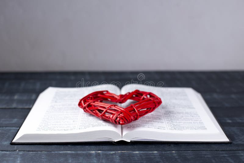 Open Bible. Red Heart on the Book. Holy Bible. Love for God Stock Photo ...
