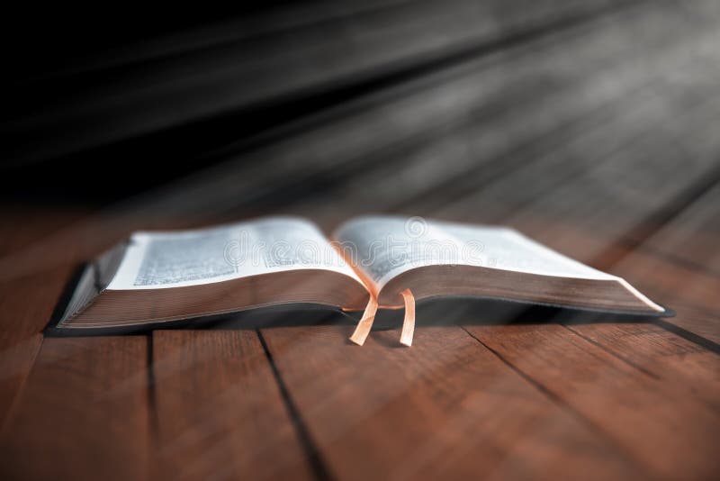 Open Bible on wooden table stock photo. Image of reading - 215688848