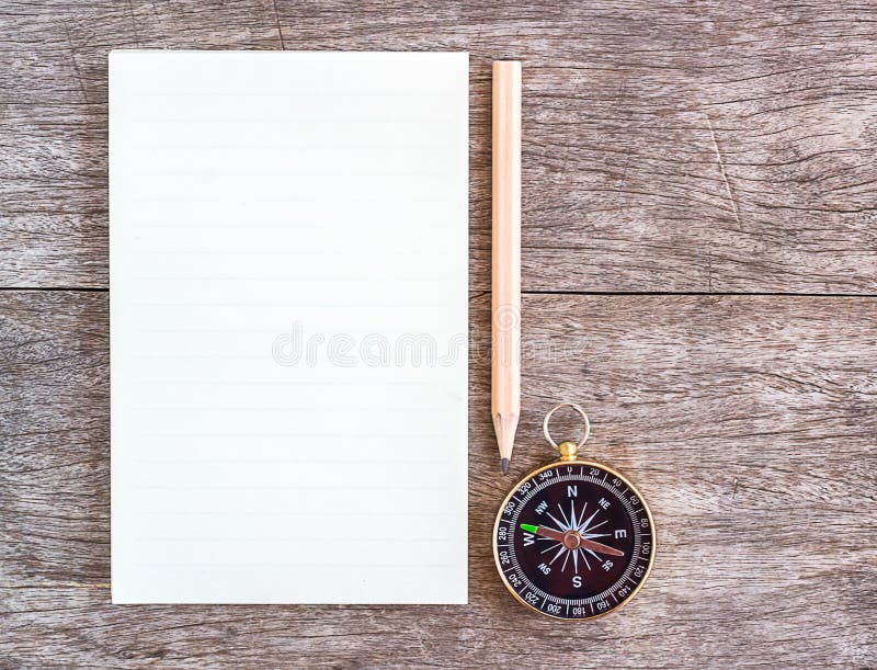 Open Blank Notebook with Pencil and Compass Over a Wooden Background ...