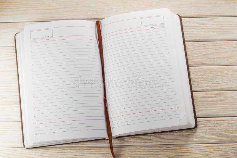Open Blank Notepad with Empty White Pages Laying on a Wooden Table ...