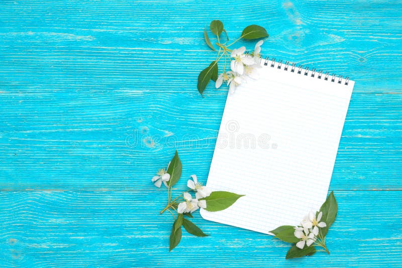 Open Blank Notepad with Blooming on Turquoise Wooden Background Stock ...