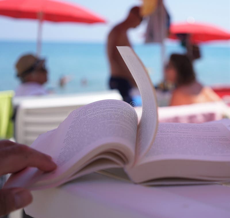 Reading at the beach stock image. Image of relax, browsing - 124159075